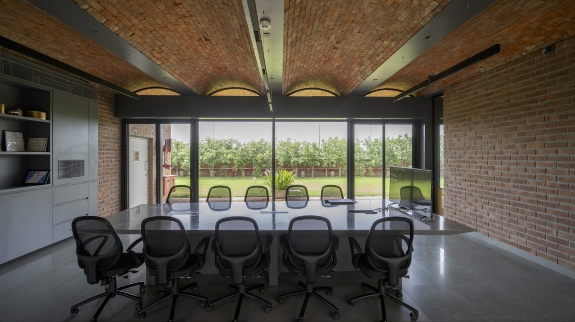 Crafting Sustainable Workspaces: Metallic Bellows Factory Office ...